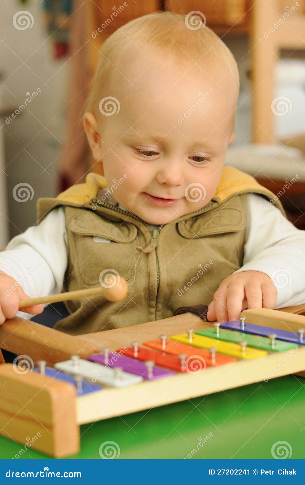 Child playing on xylophone stock image. Image of bell - 27202241