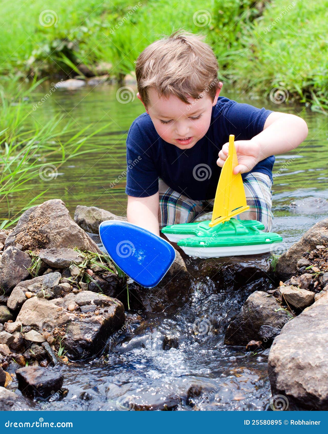 Child Plays with Boat in Creek Stock Image - Image of water, spring ...