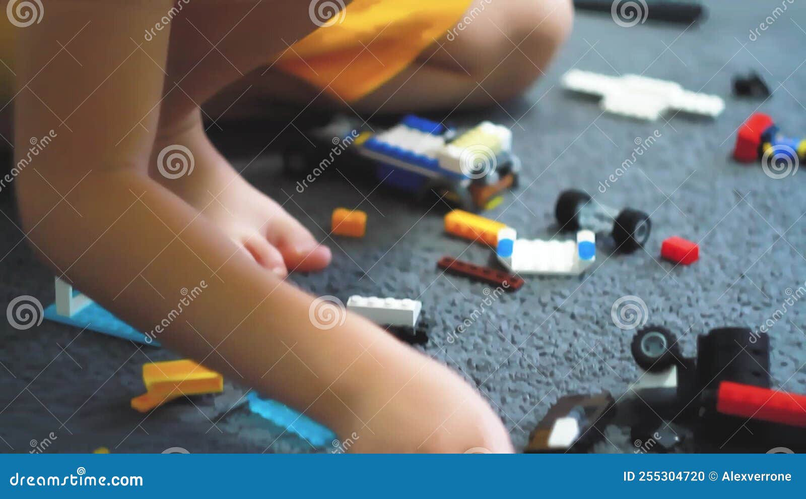 Child Plays with Constructor. Little Boy Builds Figures from Cubes of ...