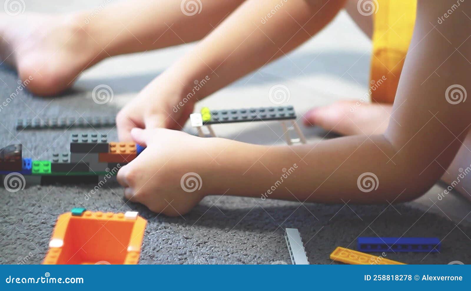 Child Plays with Constructor. Little Boy Builds Figures from Cubes of ...