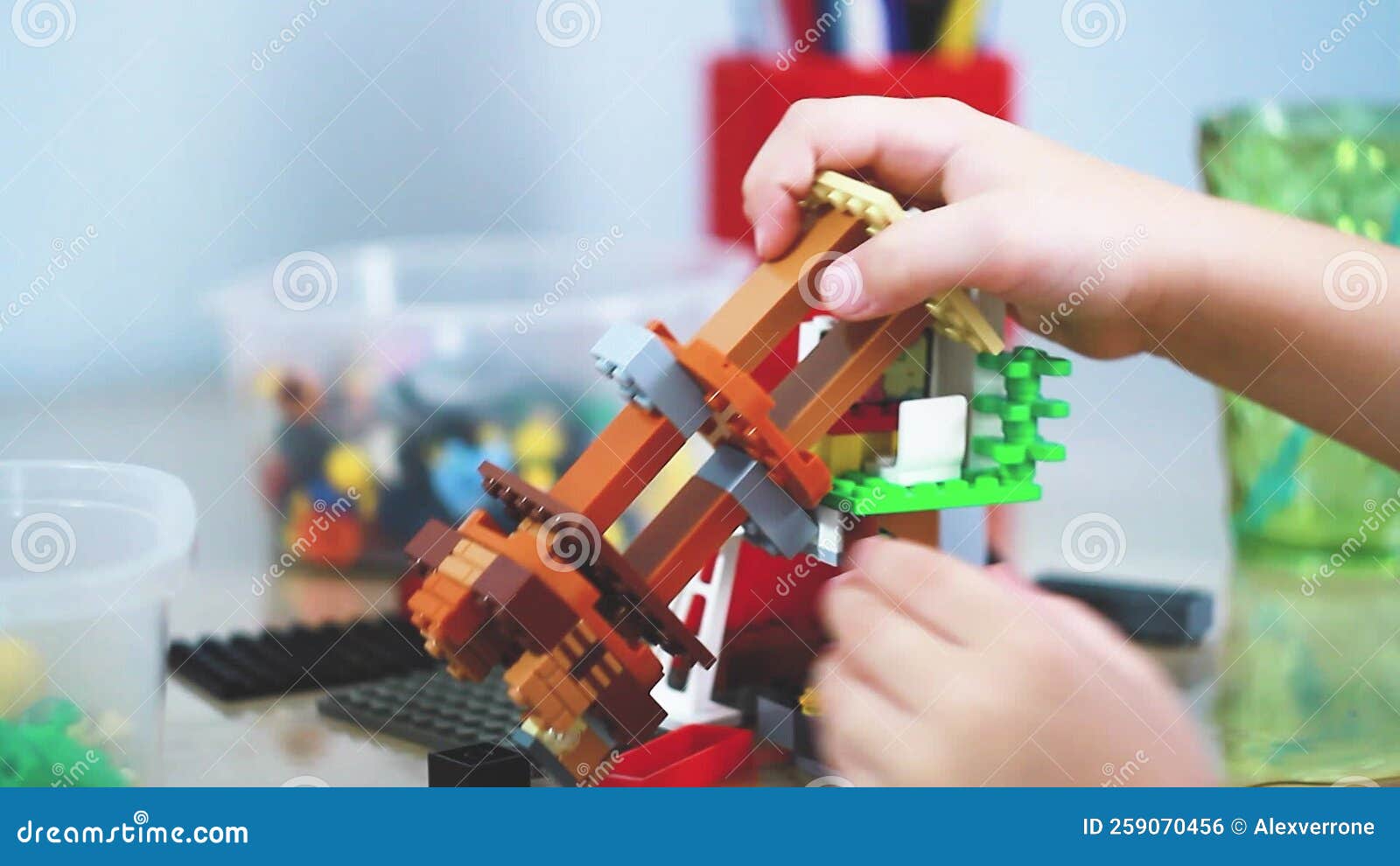 Child Plays with Constructor. Little Boy Builds Figures from Cubes of ...