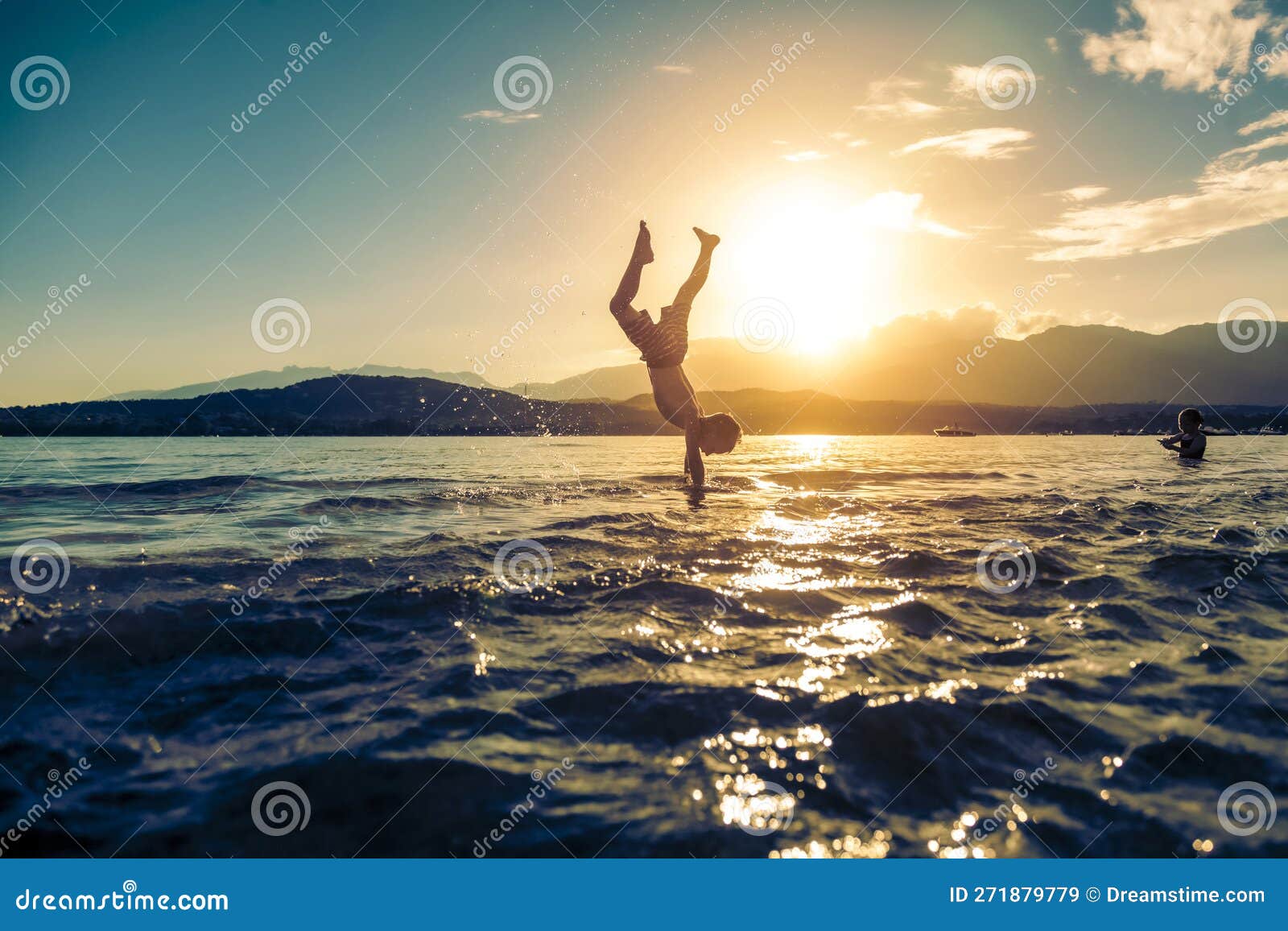 Child Plays and Has Fun in the Sea Doing Somersaults Stock Image ...