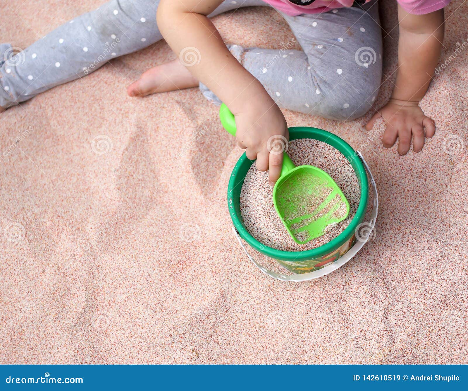 The Child Plays with His Hands in the Pink Sand Stock Image - Image of ...