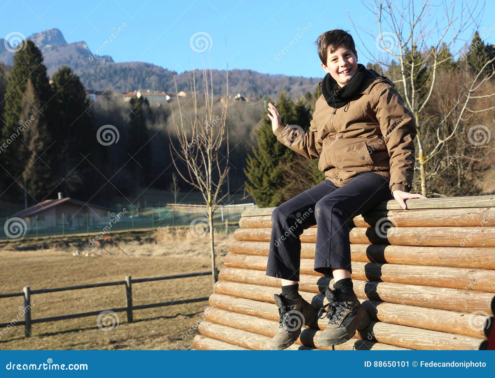 Child Plays on the House of a Mountain Playground in Winter Stock Image ...