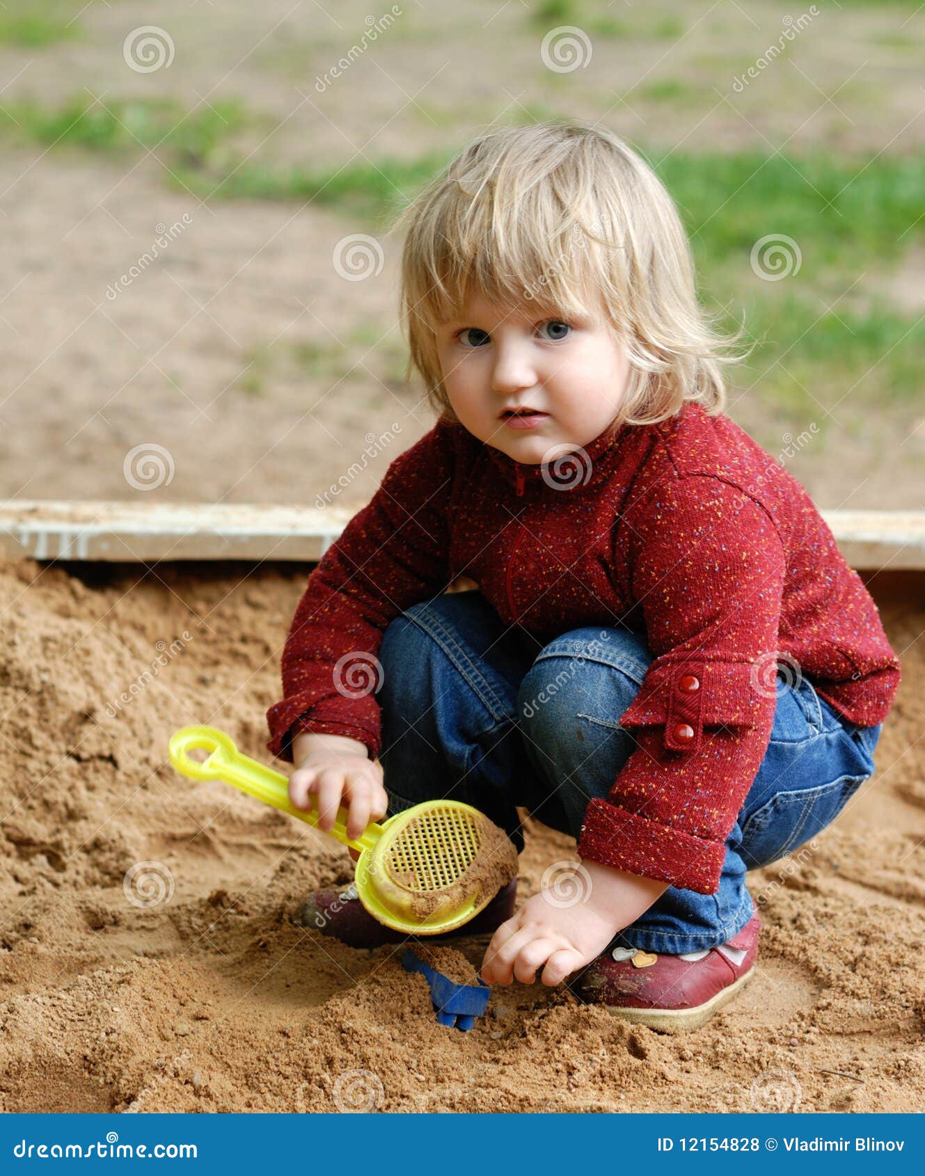 Child plays with sand stock photo. Image of playful, beauty - 12154828