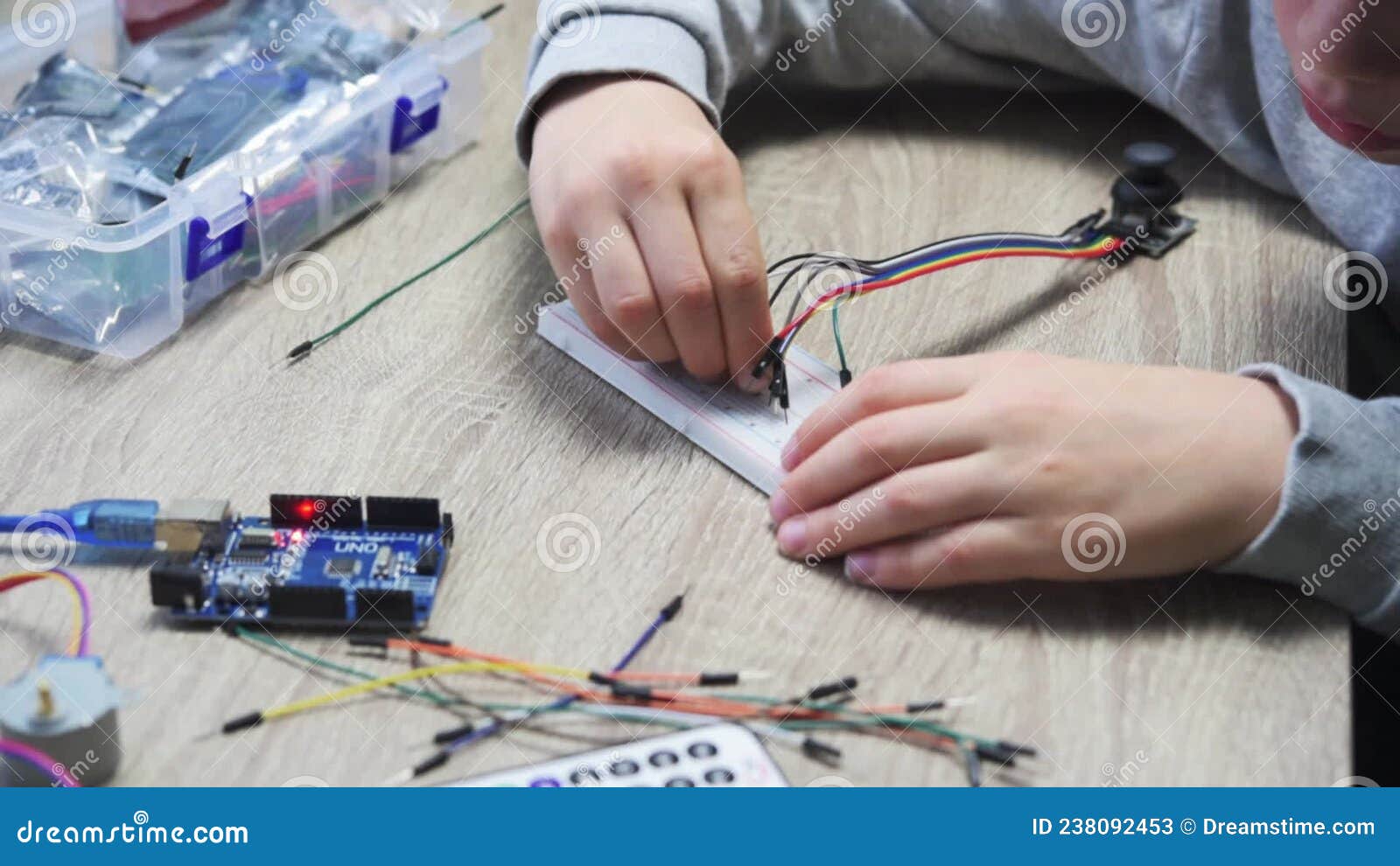 A Child Plugging Cables To Sensor Chips while Learning Arduino Coding and Robotics Stock Video ...
