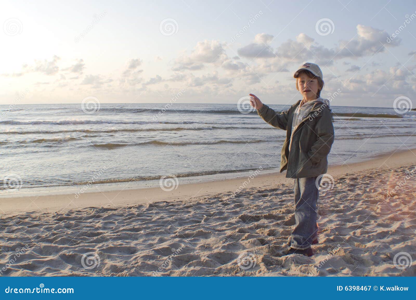 Child pointing out to sea stock image. Image of exploration - 6398467