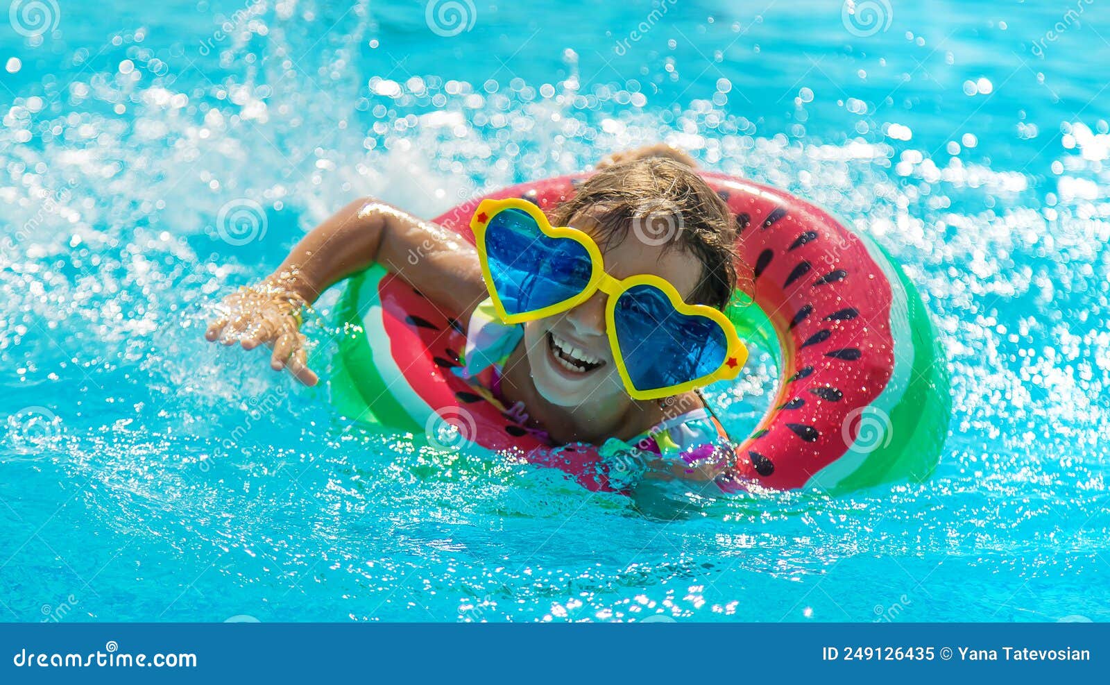 The Child in the Pool Swims in a Circle. Selective Focus Stock Image ...