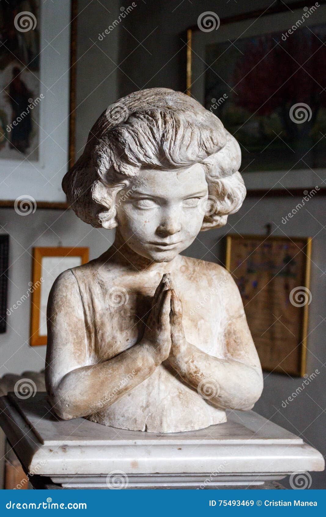 Man Praying To The Sculpture Of Rooster, A Traditional Symbol Of Wealth ...