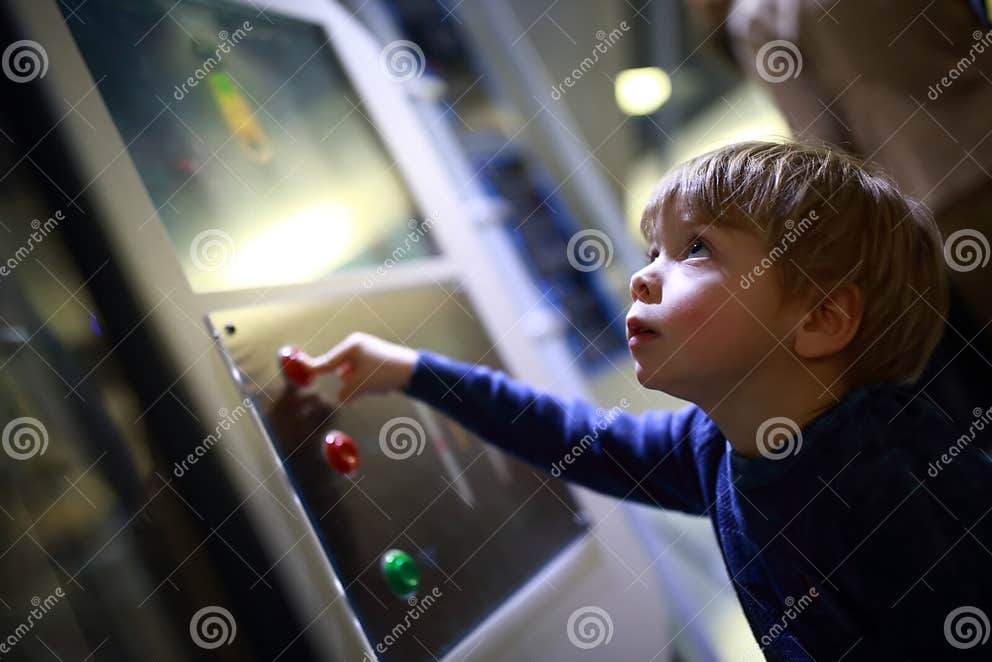 Child presses on button stock image. Image of enjoyment - 103722701