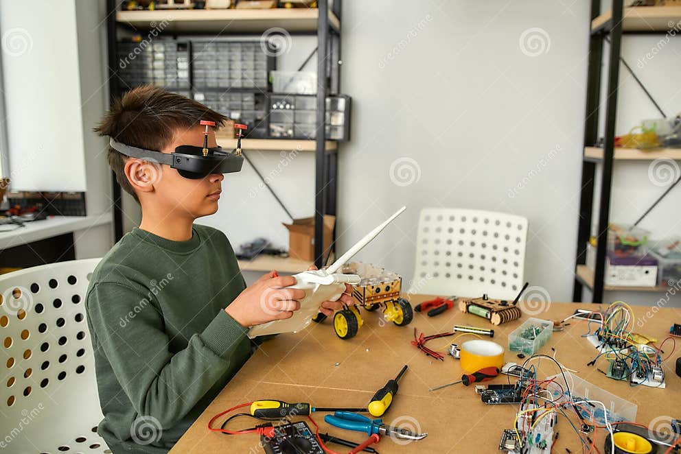 Imagine it. Child Programming, Testing Robot Vehicle, Using Console ...