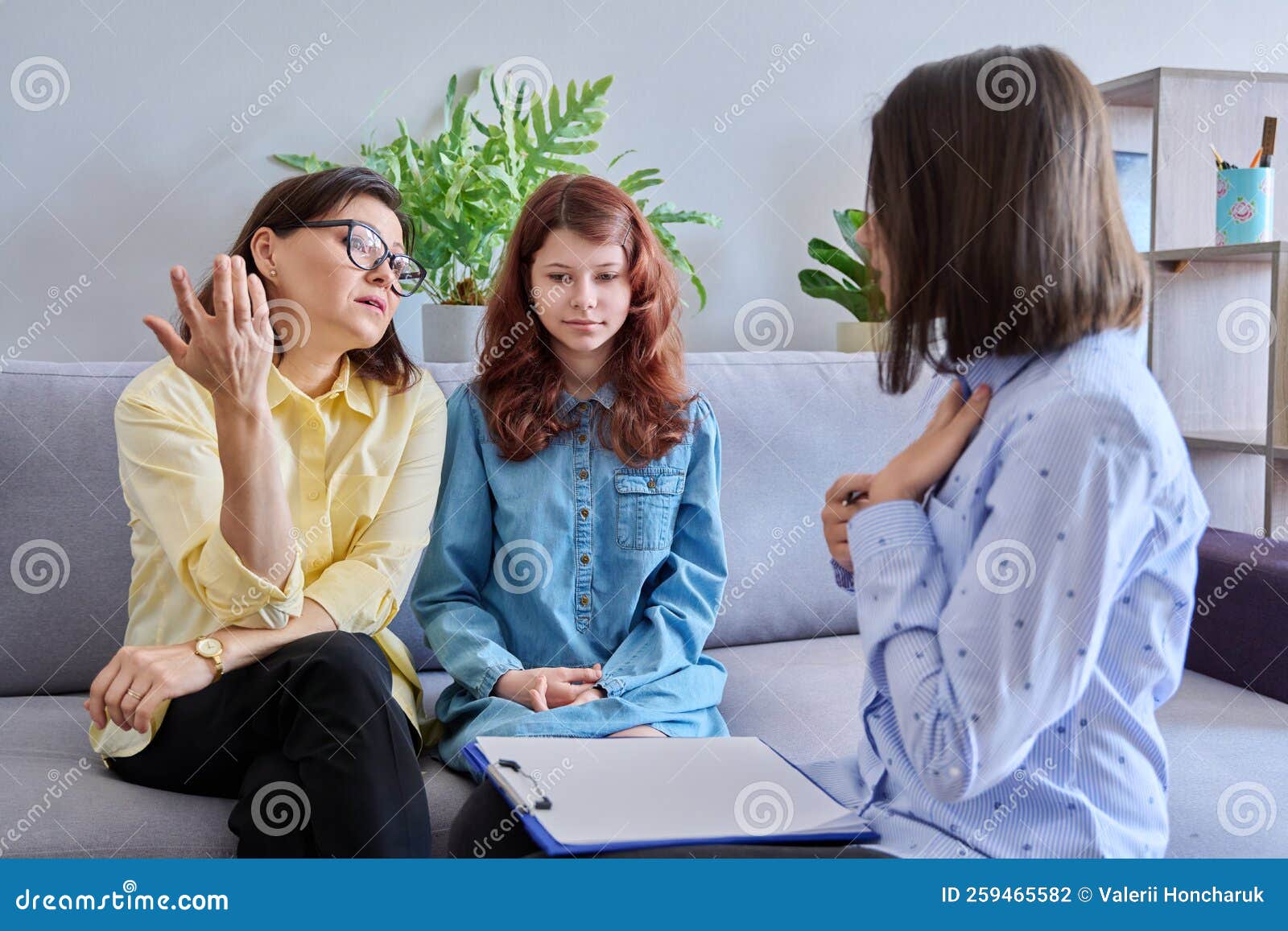 Mother And Preteen Girl Reading Blurred Stock Image