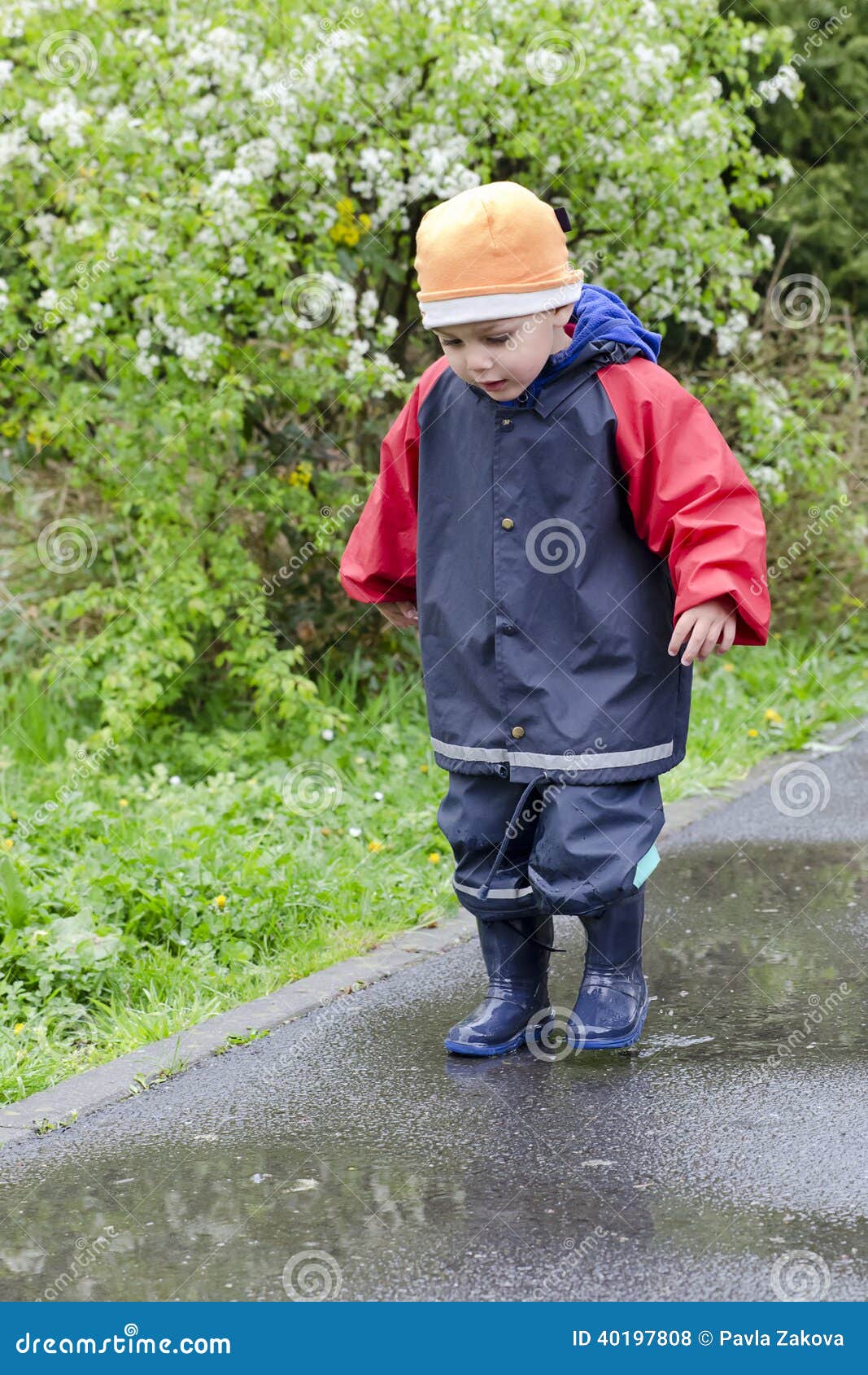 Child in puddle stock photo. Image of playing, happy - 40197808