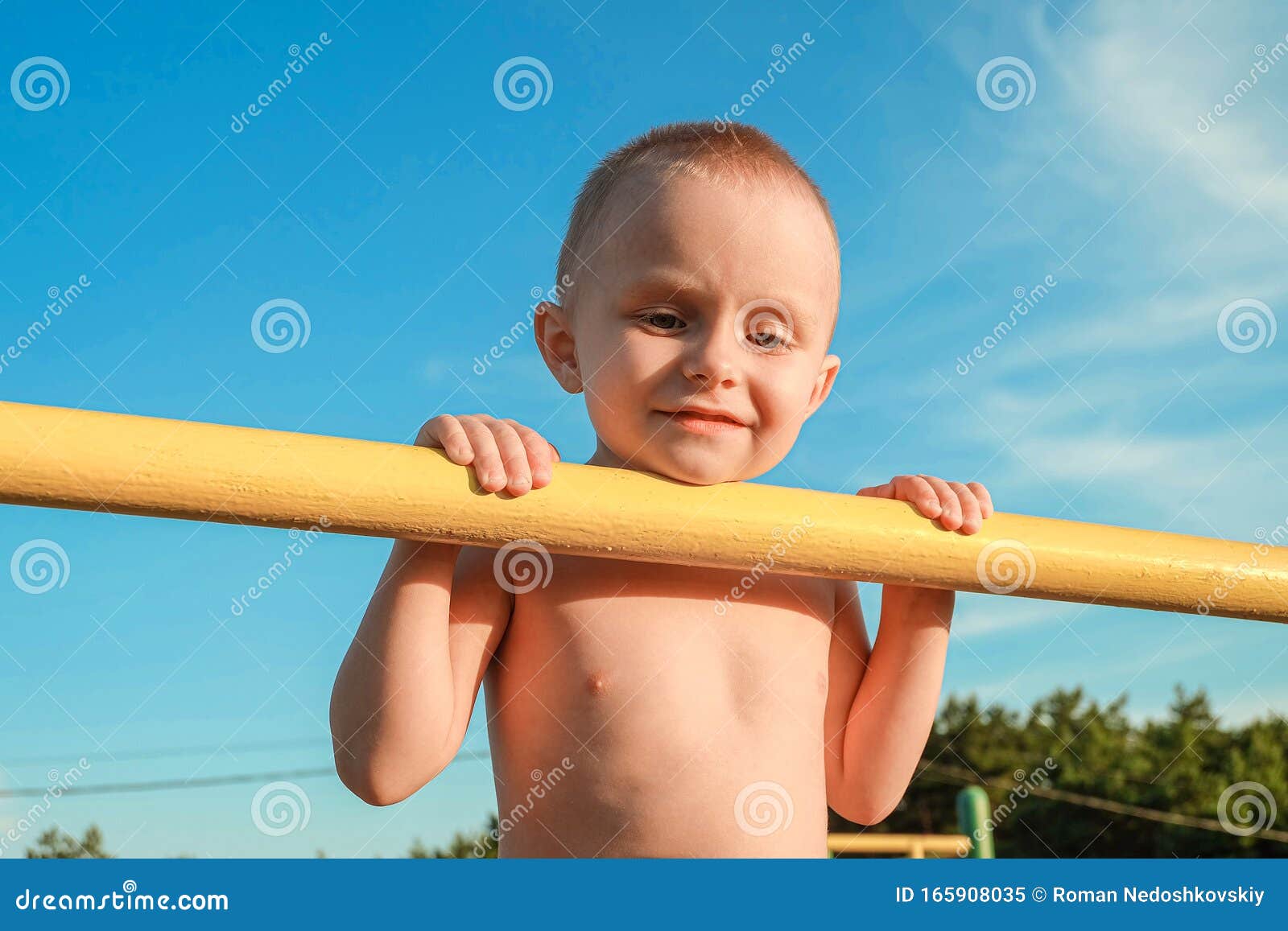 Child is Pulled Up on Outdoors Horizontal Bar Stock Image - Image of ...
