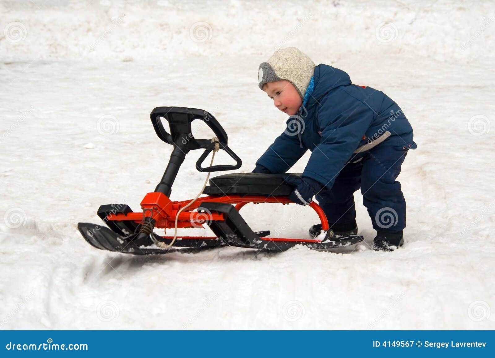 The child pushes sledge stock image. Image of season, cute - 4149567