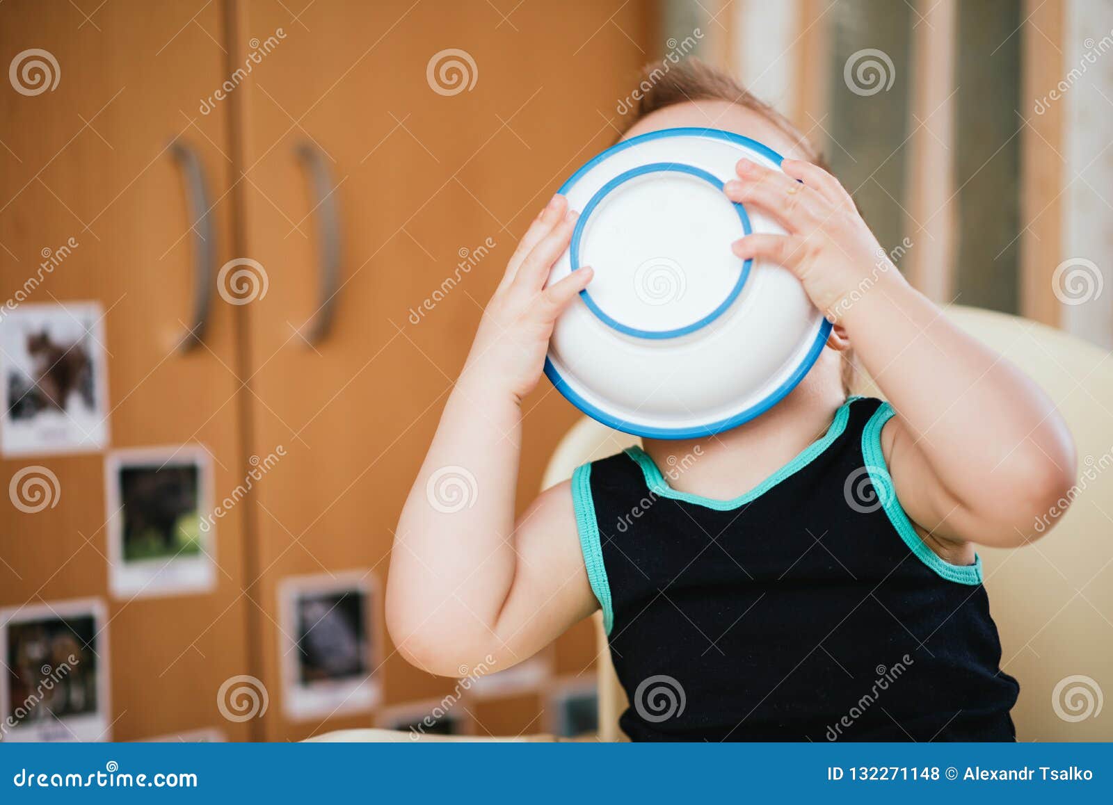 The Child Put a Bowl on His Head Stock Photo - Image of lunch, funny ...