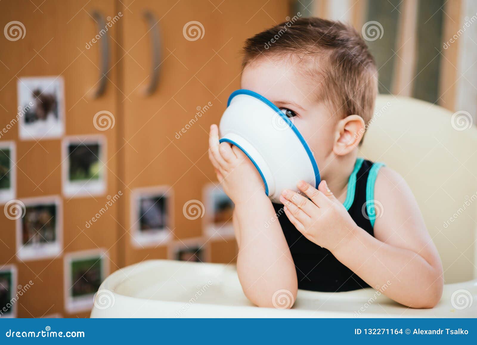 The Child Put a Bowl on His Head Stock Photo - Image of messy, lunch ...