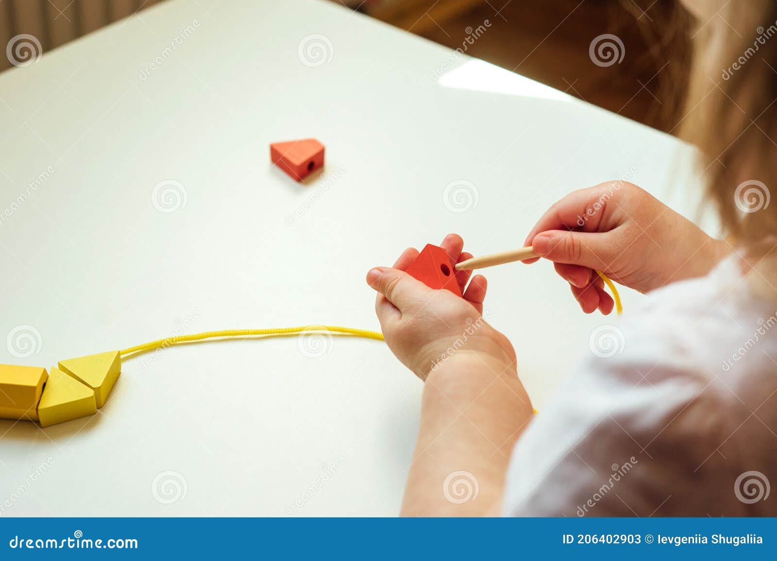 Child Putting Beads on a String. Bead Stringing Activity Stock Image ... Child Putting Beads on a String. Bead Stringing Activity Stock Image ...