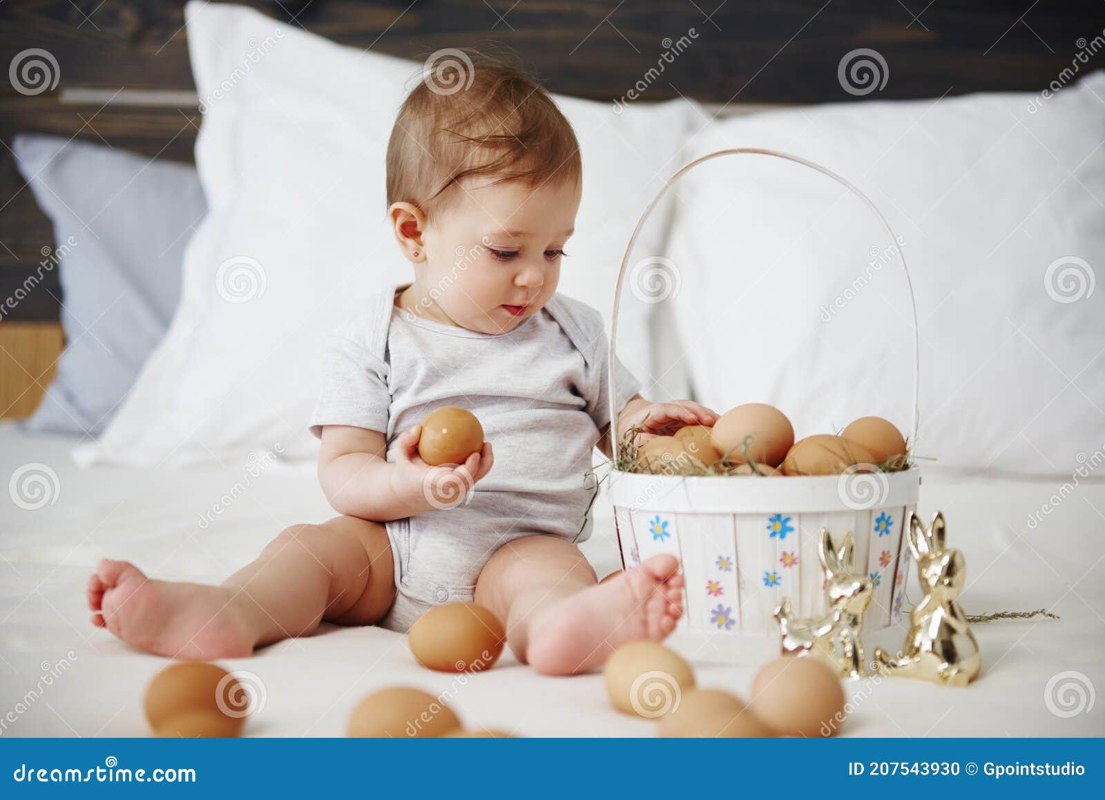 Child Putting Eggs in the Easter Basket Stock Photo - Image of serious ...