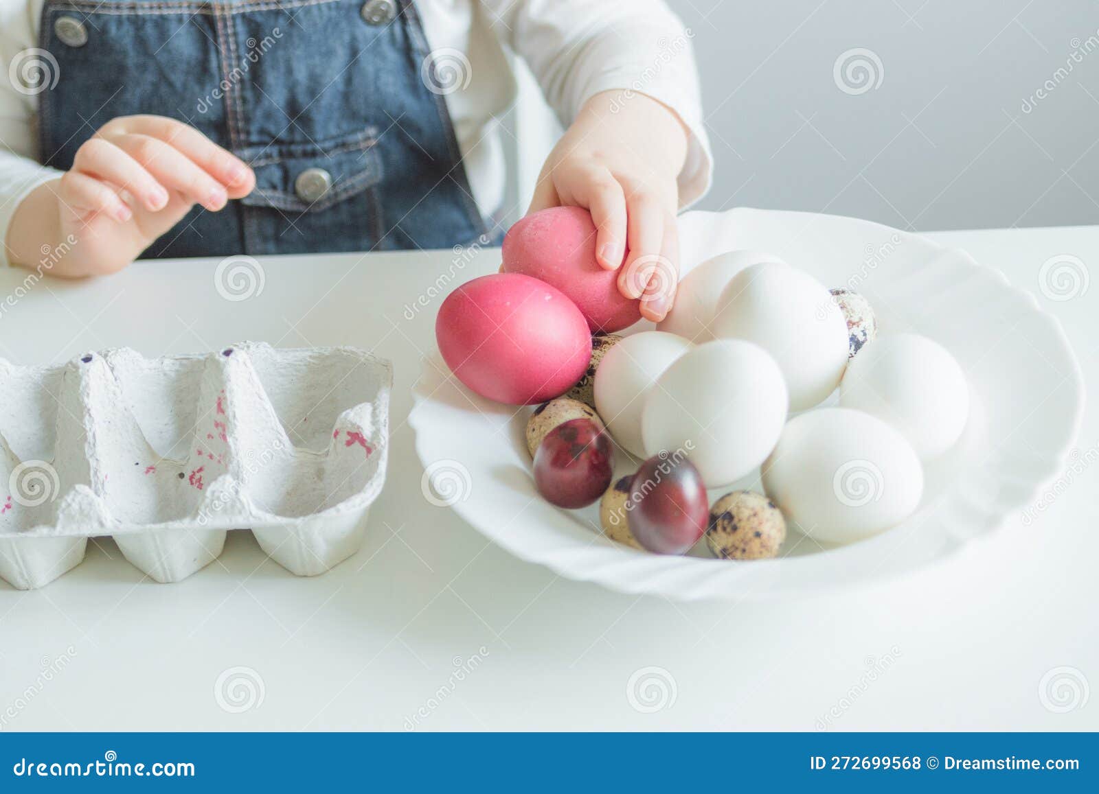 A Child is Putting Eggs in an Empty Paper Holder Stock Photo - Image of ...