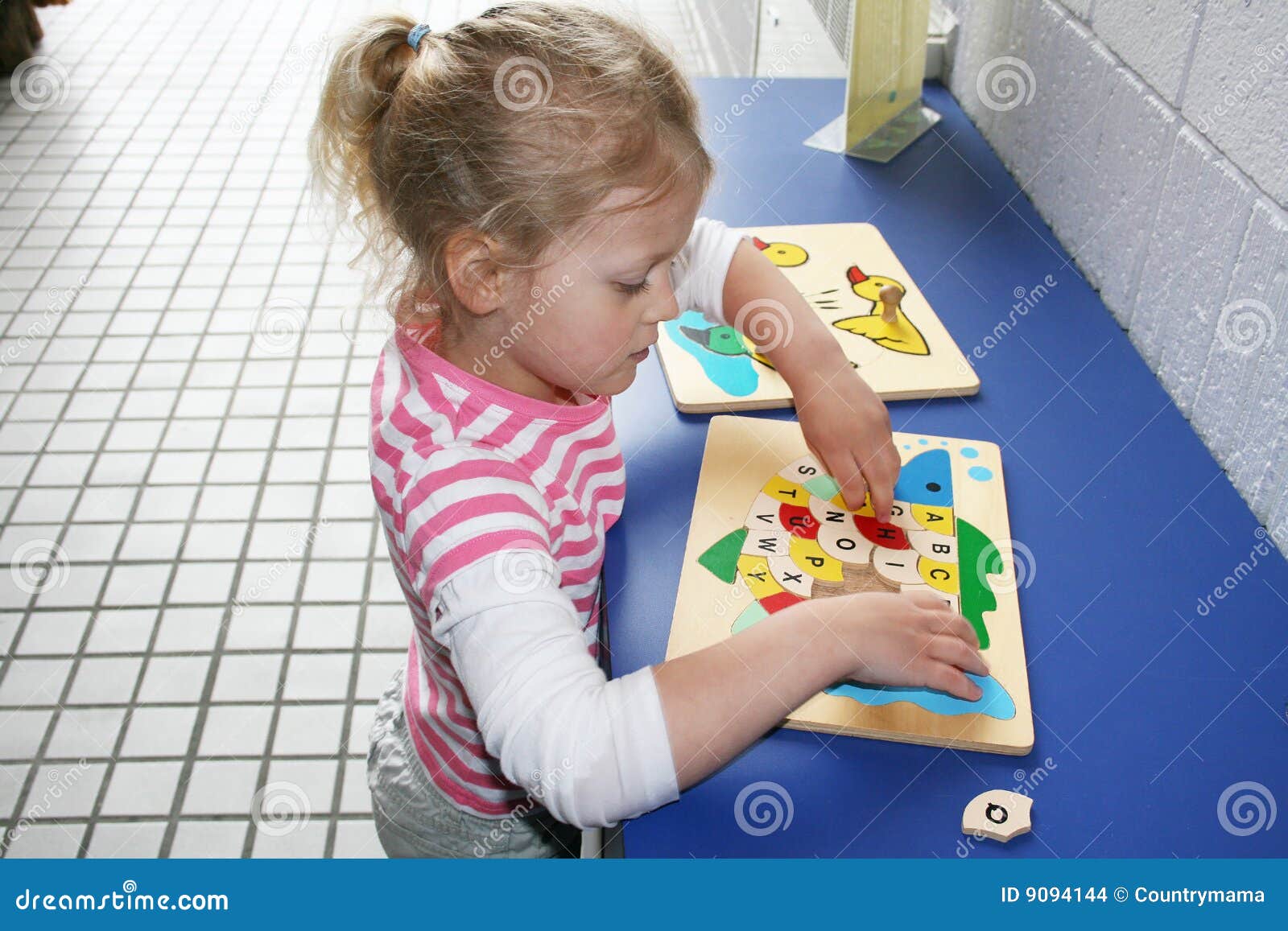 Child with puzzle. stock photo. Image of young, puzzle - 9094144