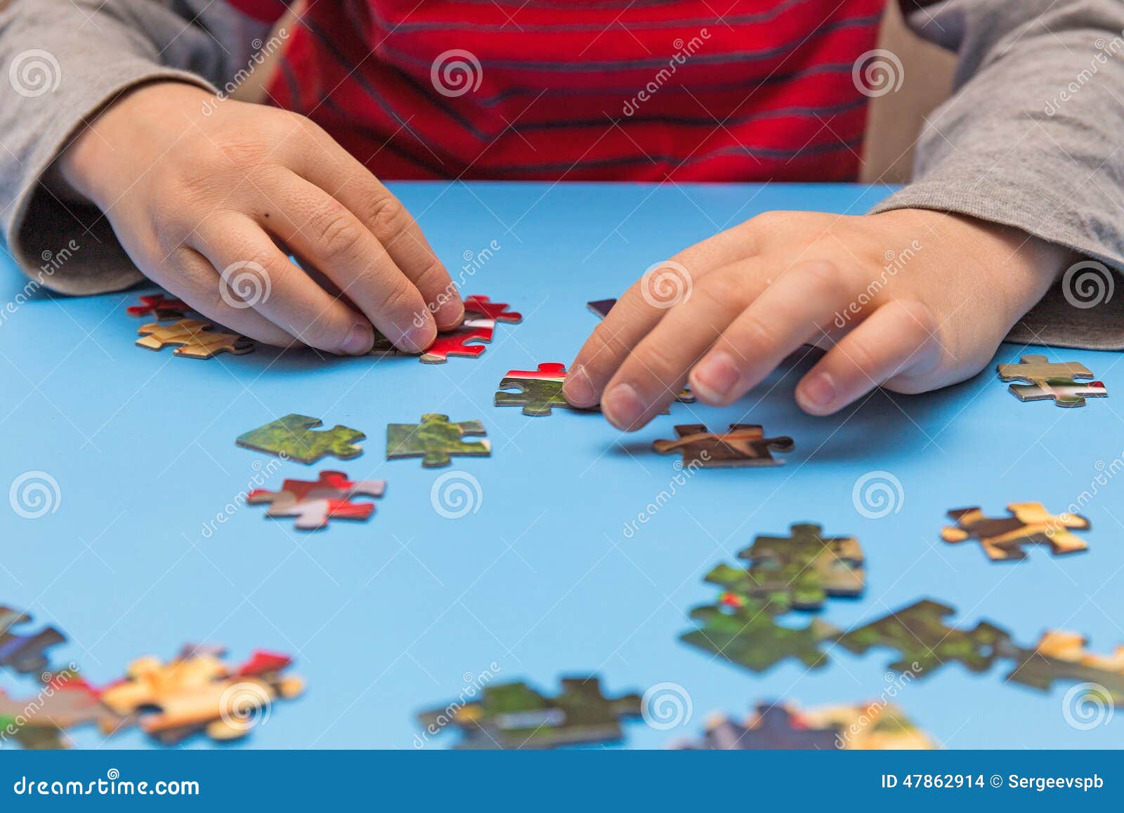 Child and puzzles stock photo. Image of development, creativity - 47862914
