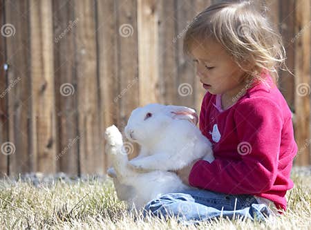 Child and rabbit stock image. Image of adorable, innocent - 14130587