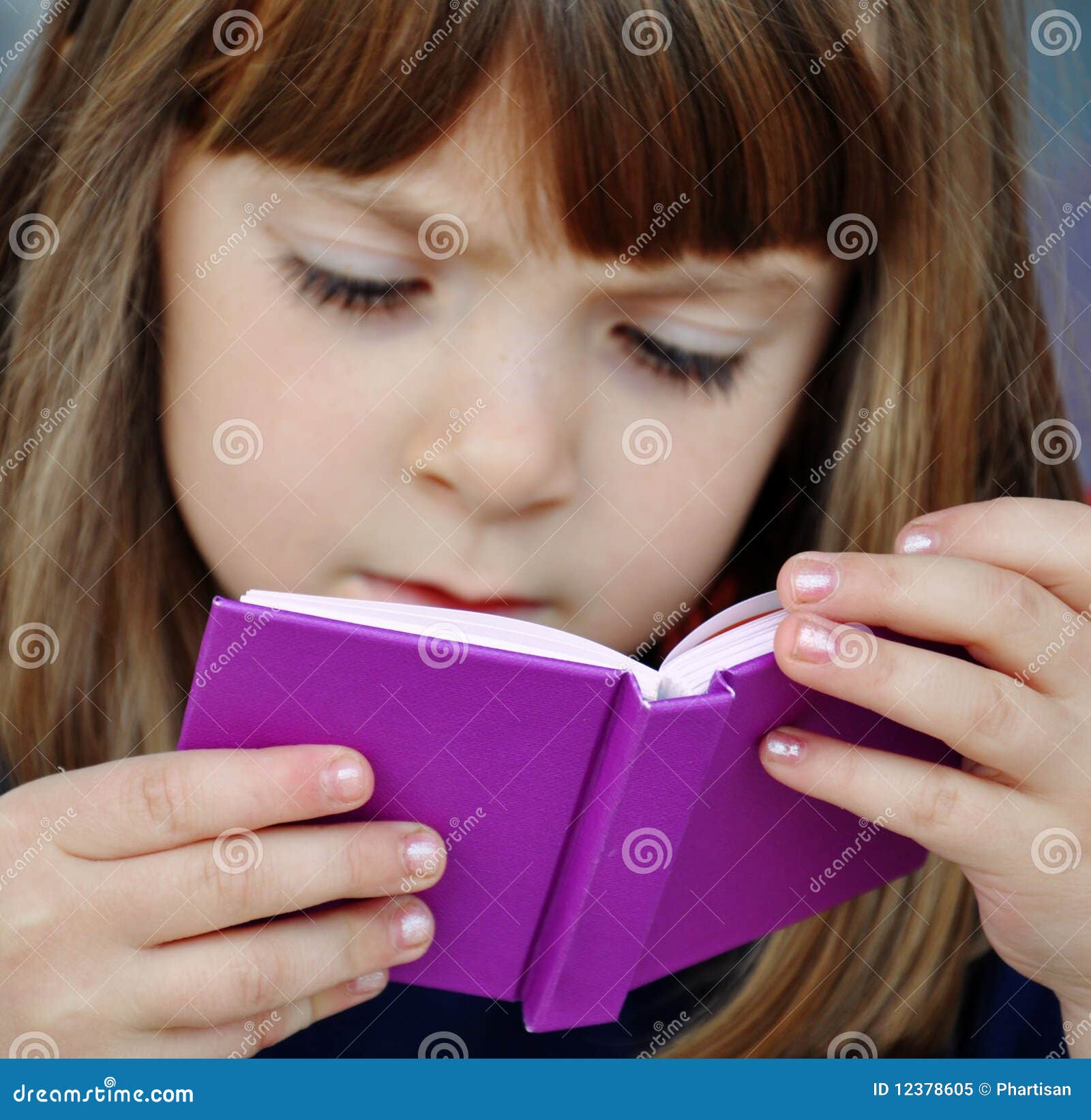 Child reading book stock image. Image of girl, laying - 12378605