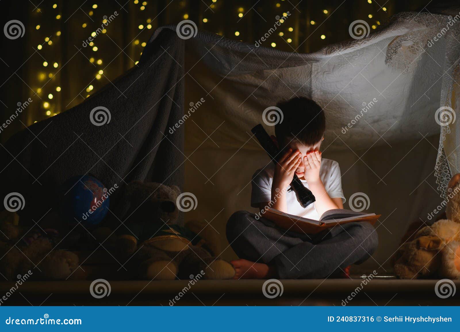 The Child is Reading a Book with a Flashlight Stock Photo - Image of ...