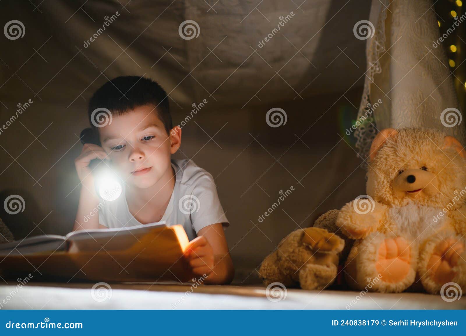 The Child is Reading a Book with a Flashlight Stock Image - Image of ...