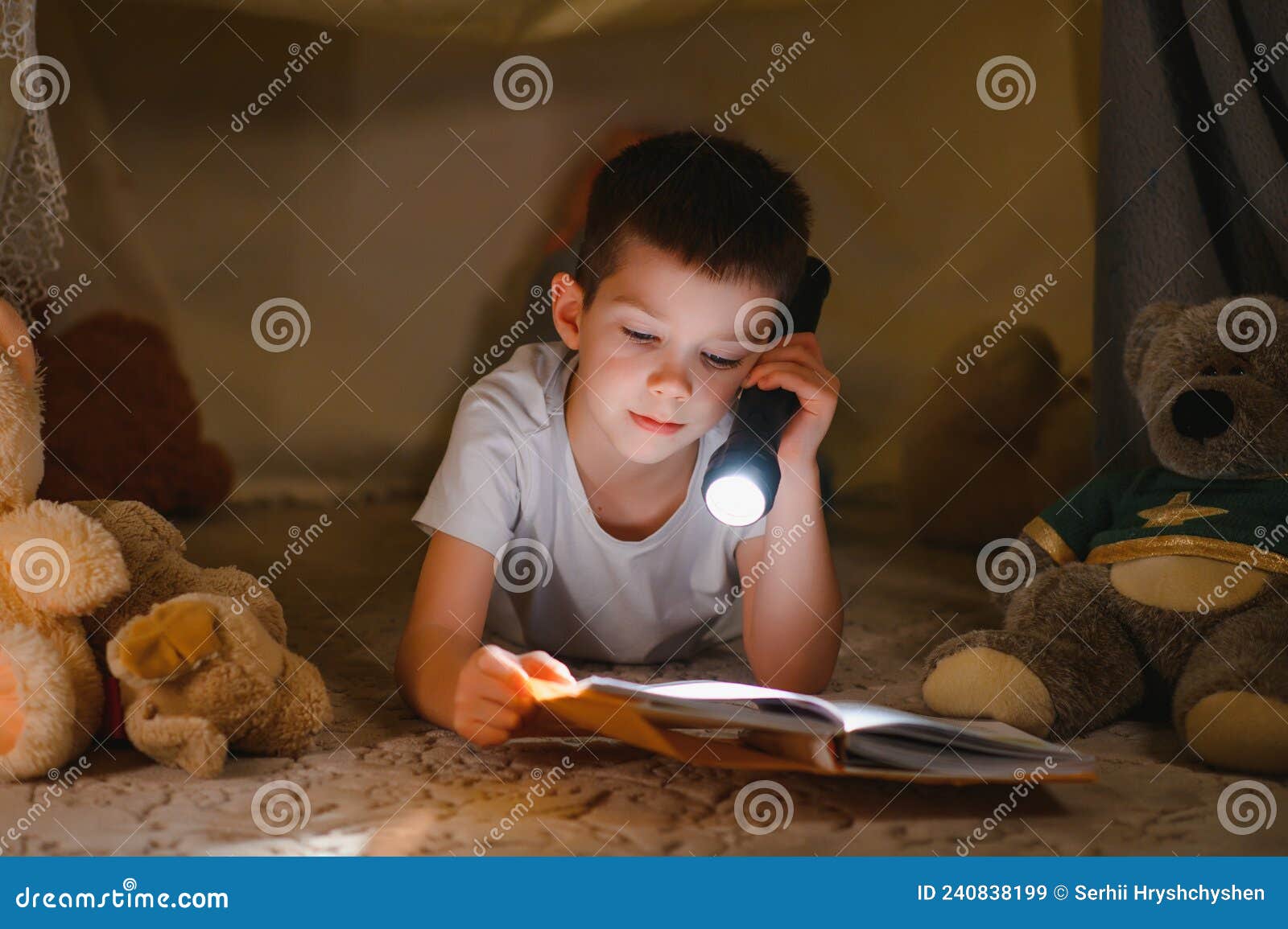 The Child is Reading a Book with a Flashlight Stock Image - Image of ...