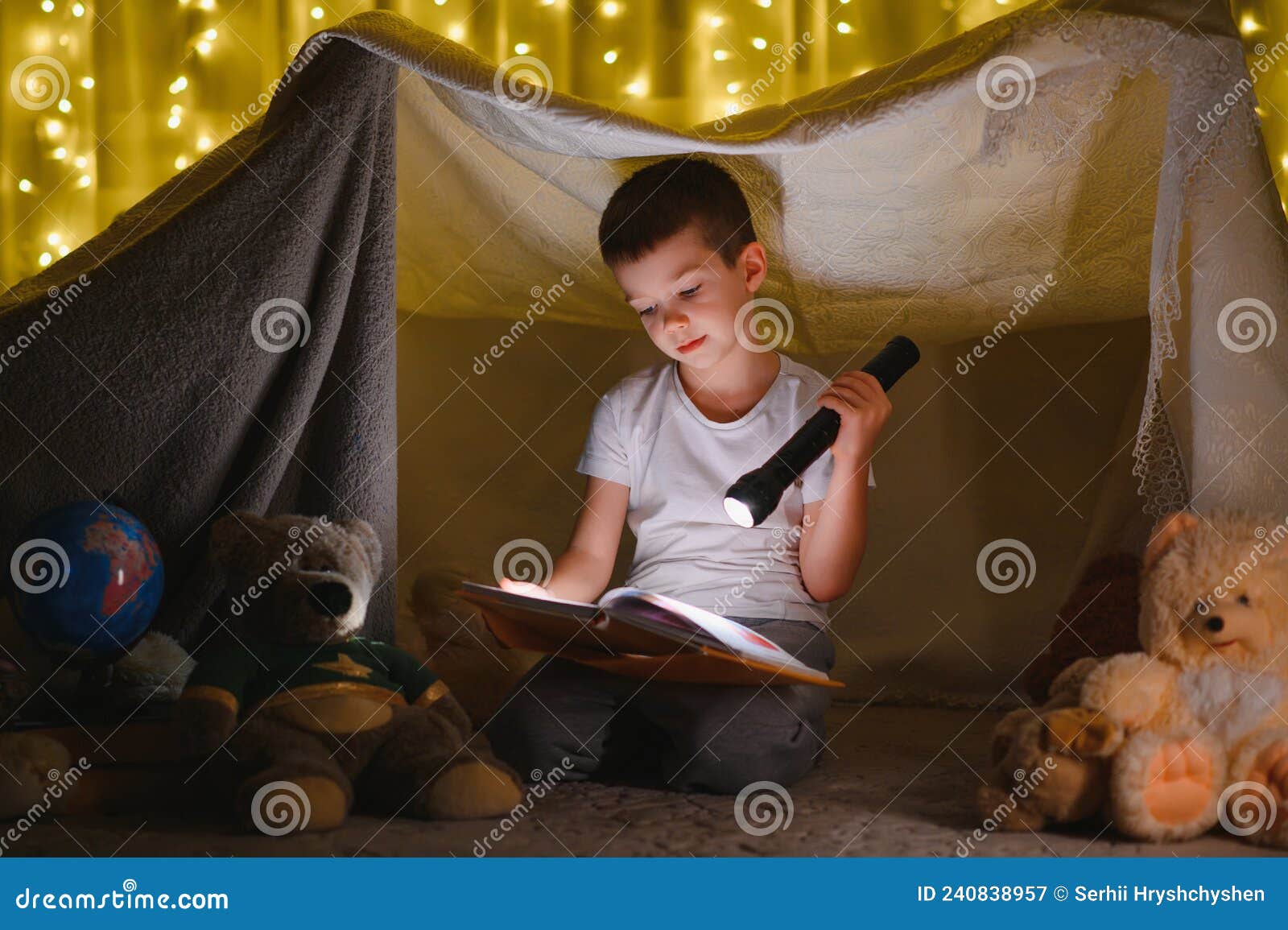The Child is Reading a Book with a Flashlight Stock Image - Image of ...