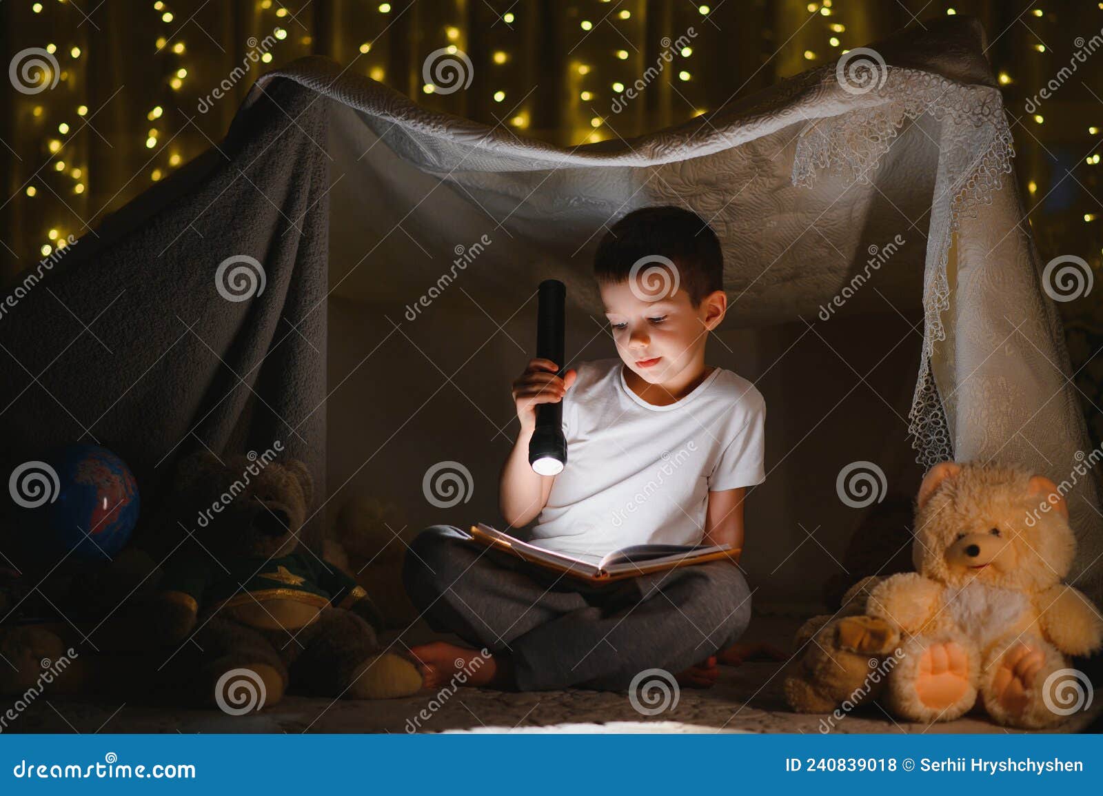 The Child is Reading a Book with a Flashlight Stock Photo - Image of ...