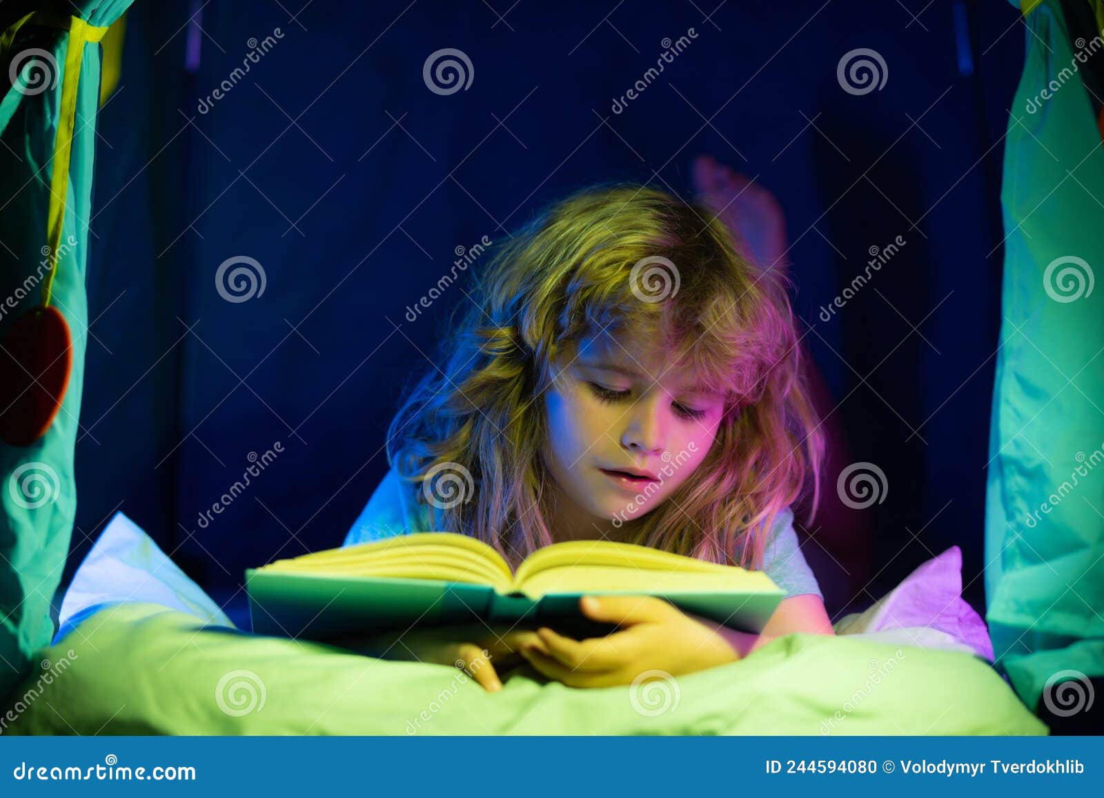 Child Reading Book. Kids Bedtime. Boy Reading a Book in Bed. Stock ...