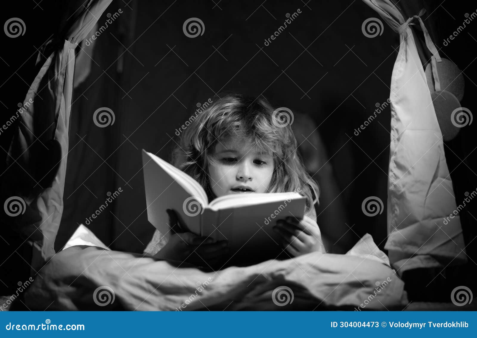 Child Reading Book. Kids Bedtime. Boy Read Book in Bed. Stock Image ...