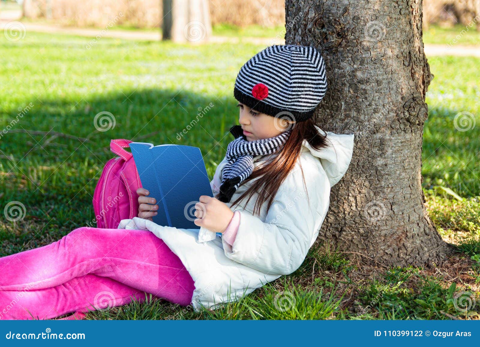 Child Reading the Book Outdoors in the Park Stock Photo - Image of ...