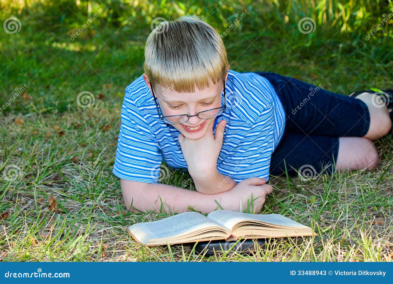 Child Reading a Book stock image. Image of book, smile - 33488943