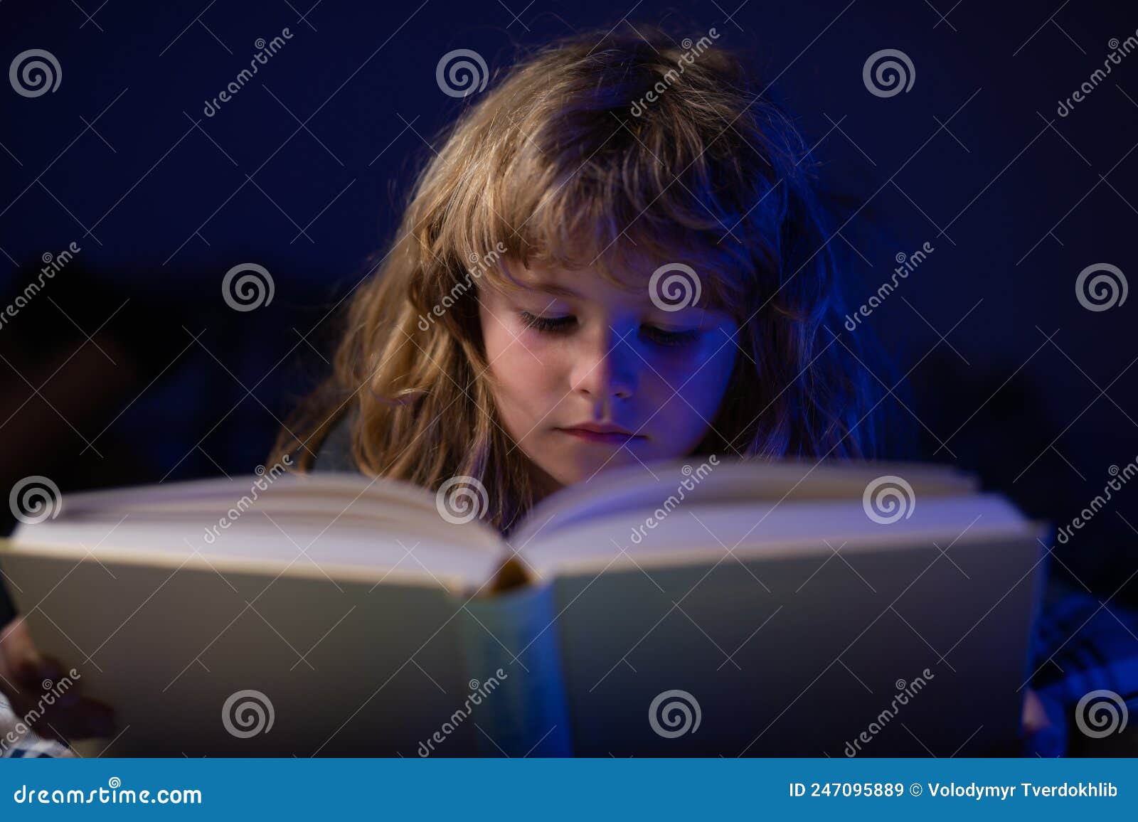 Child Reading a Magic Book in Bed. Kid Boy Read Books at Home ...