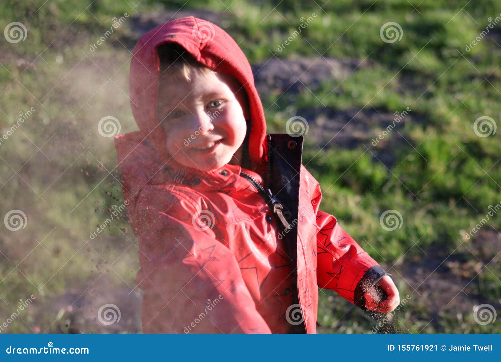 Child in red throwing sand stock image. Image of natural - 155761921