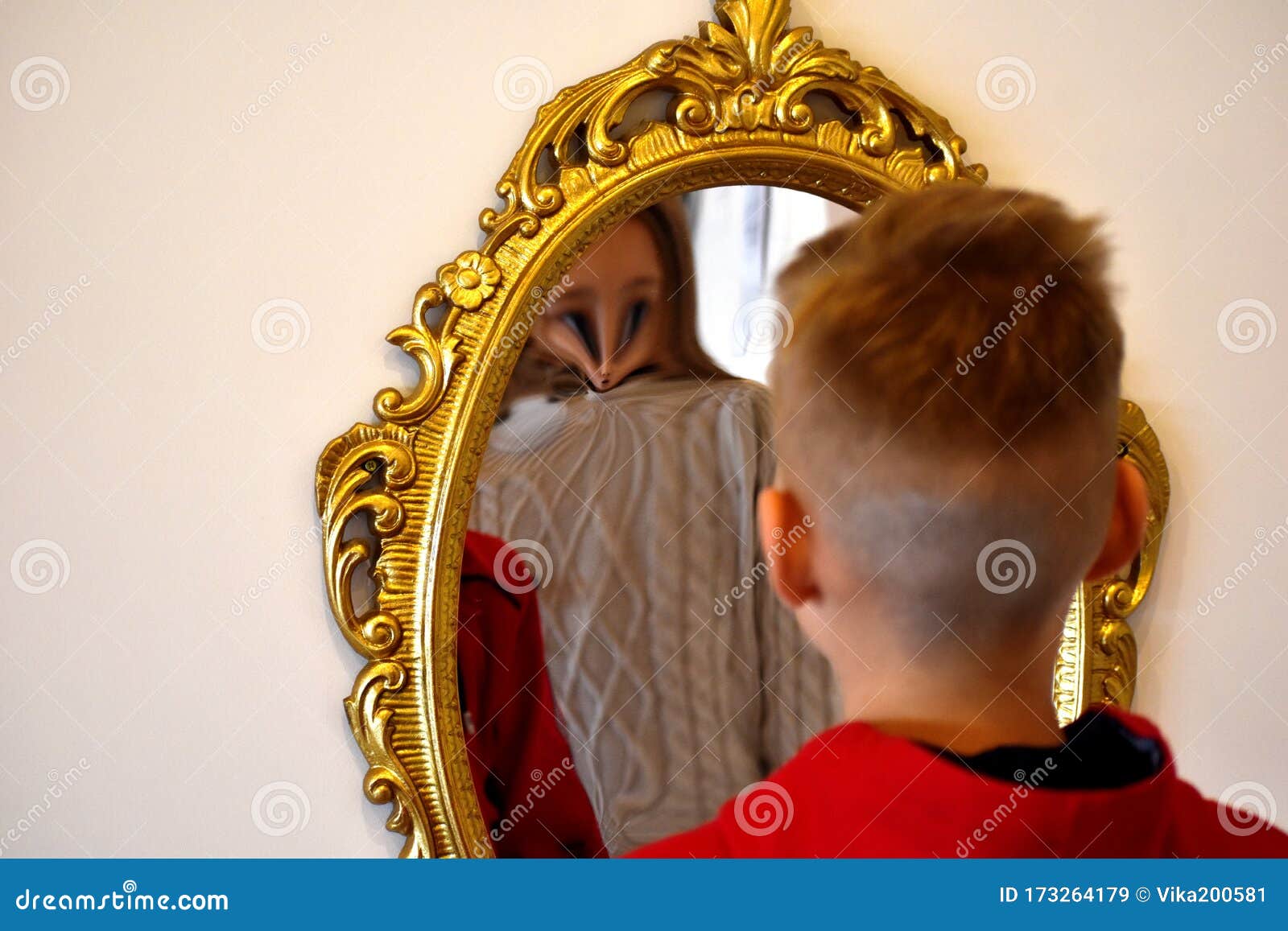The Child Reflected in a Distorting Mirror. a Fun Reflection of the Boy ...