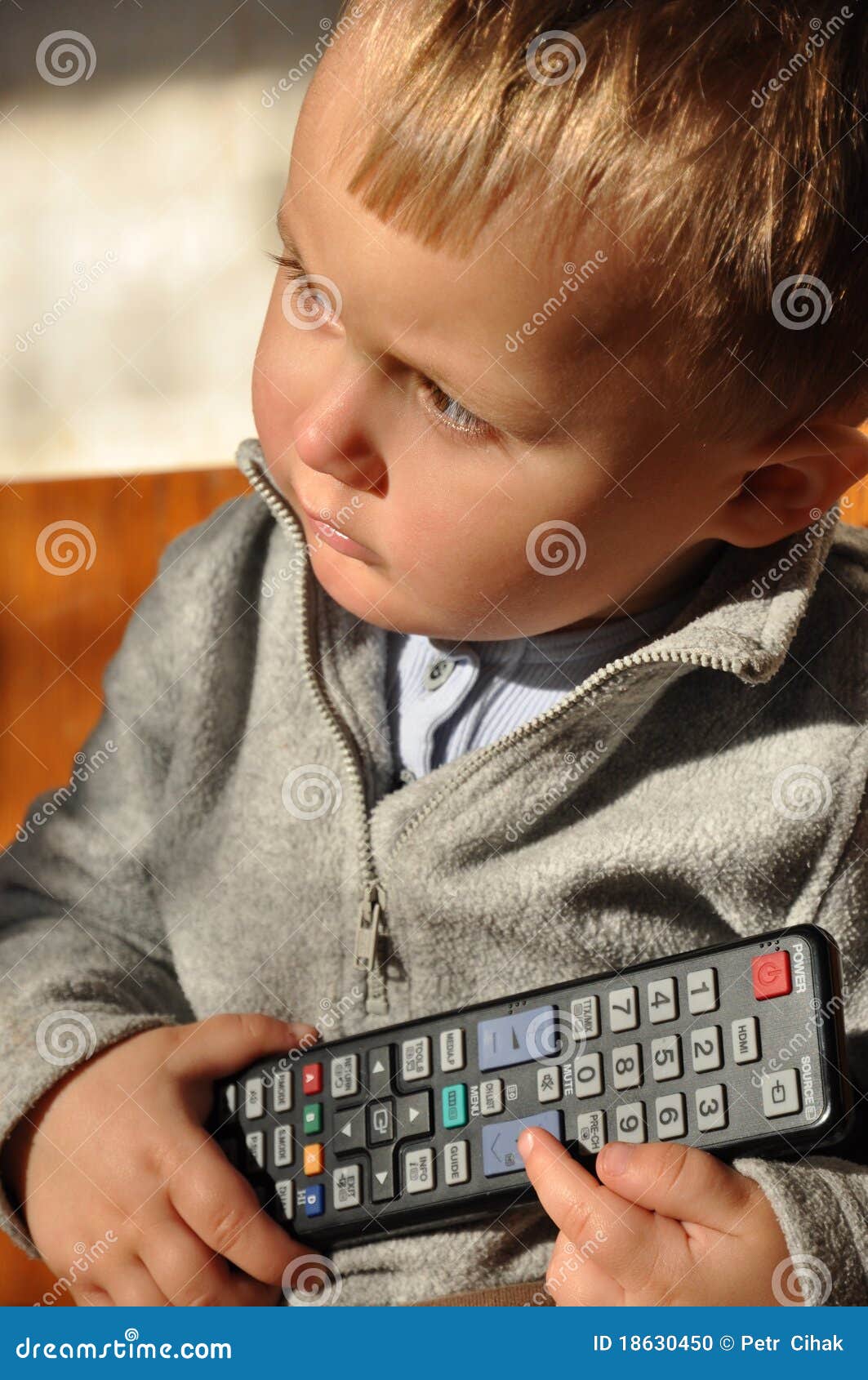 Child with remote control stock photo. Image of look - 18630450