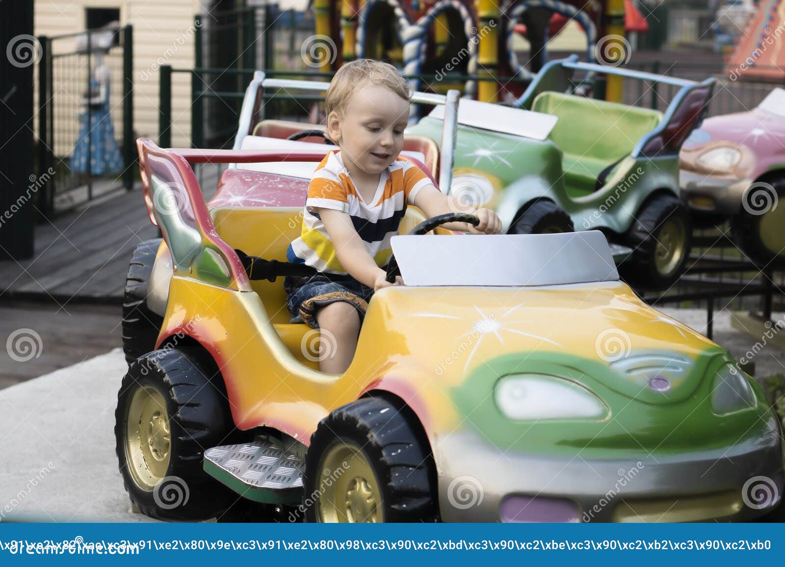 A Child Rides a Car in the Amusement Park Stock Photo - Image of bump ...