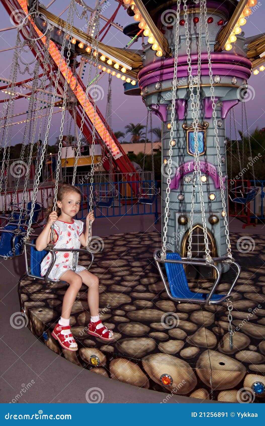 Child rides a carousel stock image. Image of rides, attraction - 21256891