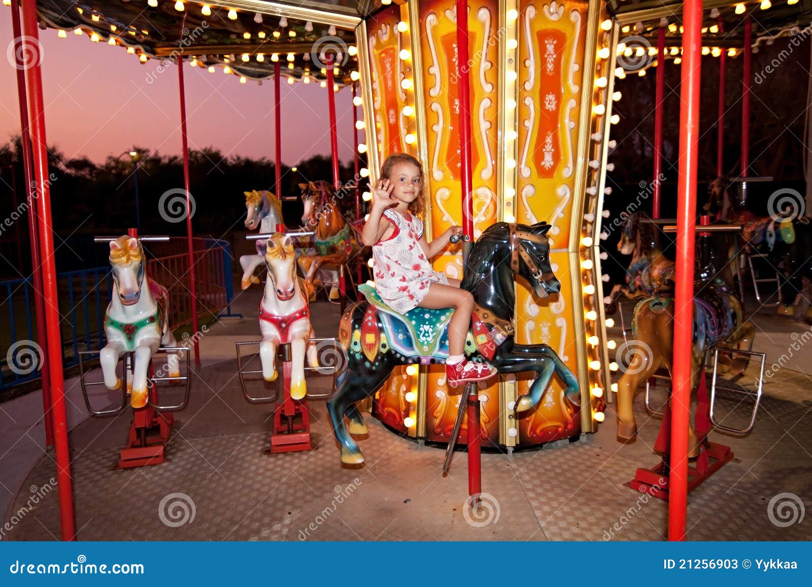 Child rides a carousel stock image. Image of park, entertainmant - 21256903