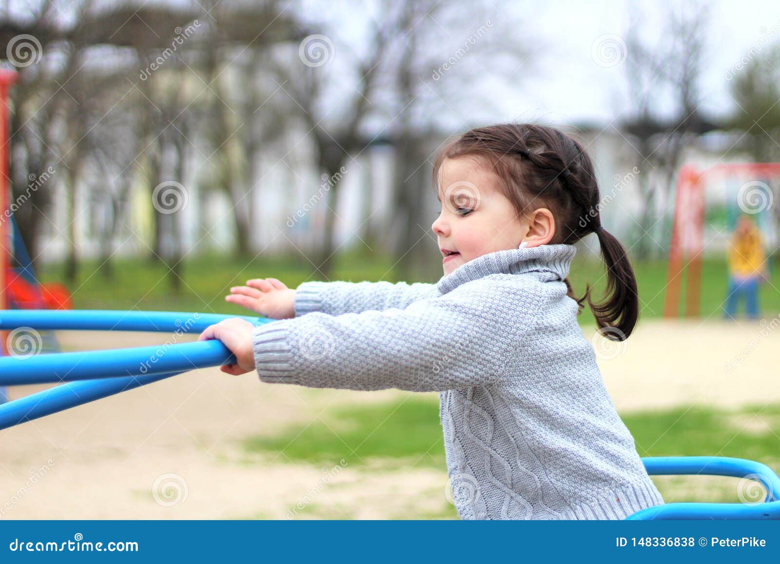 Child Rides on the Carousel in the Playground Stock Photo - Image of ...