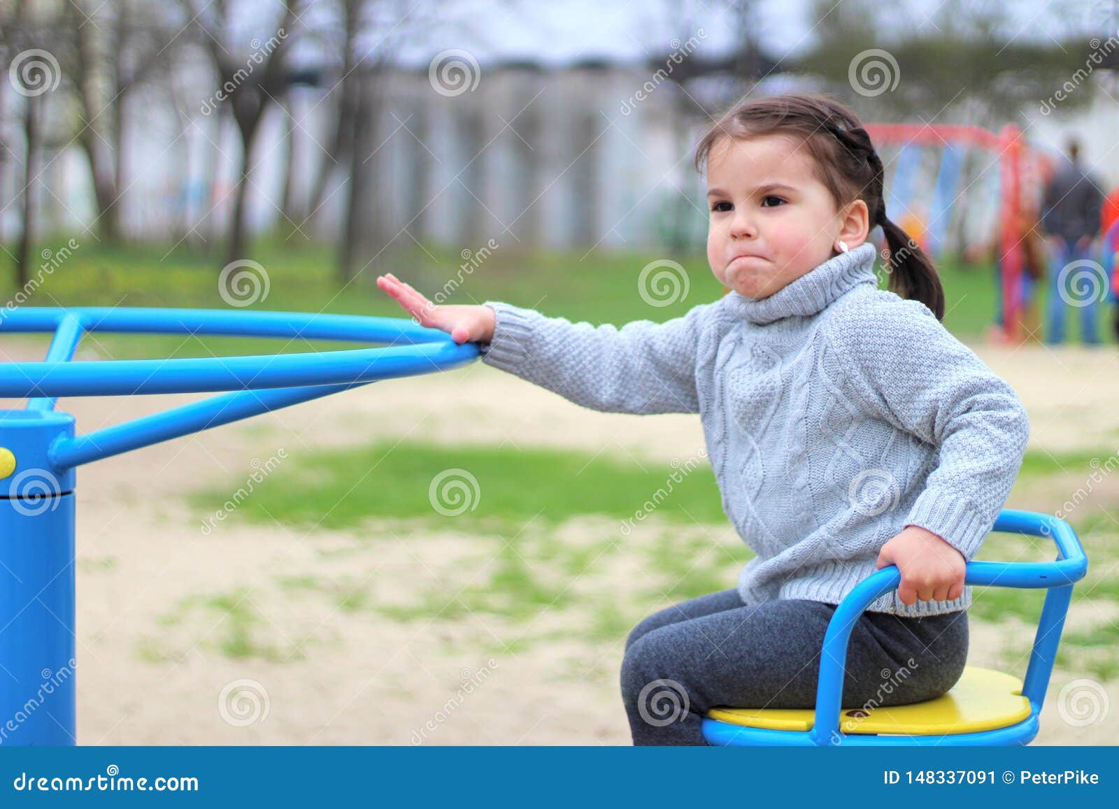 Child Rides on the Carousel in the Playground Stock Image - Image of ...