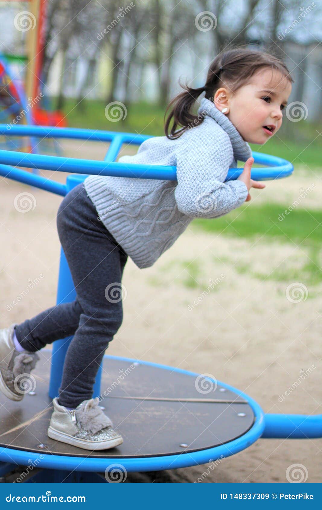 Child Rides on the Carousel in the Playground Stock Image - Image of ...