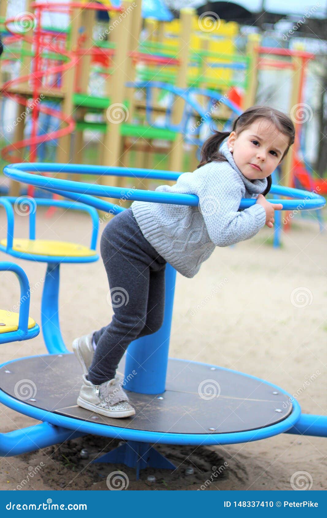 Child Rides on the Carousel in the Playground Stock Photo - Image of ...