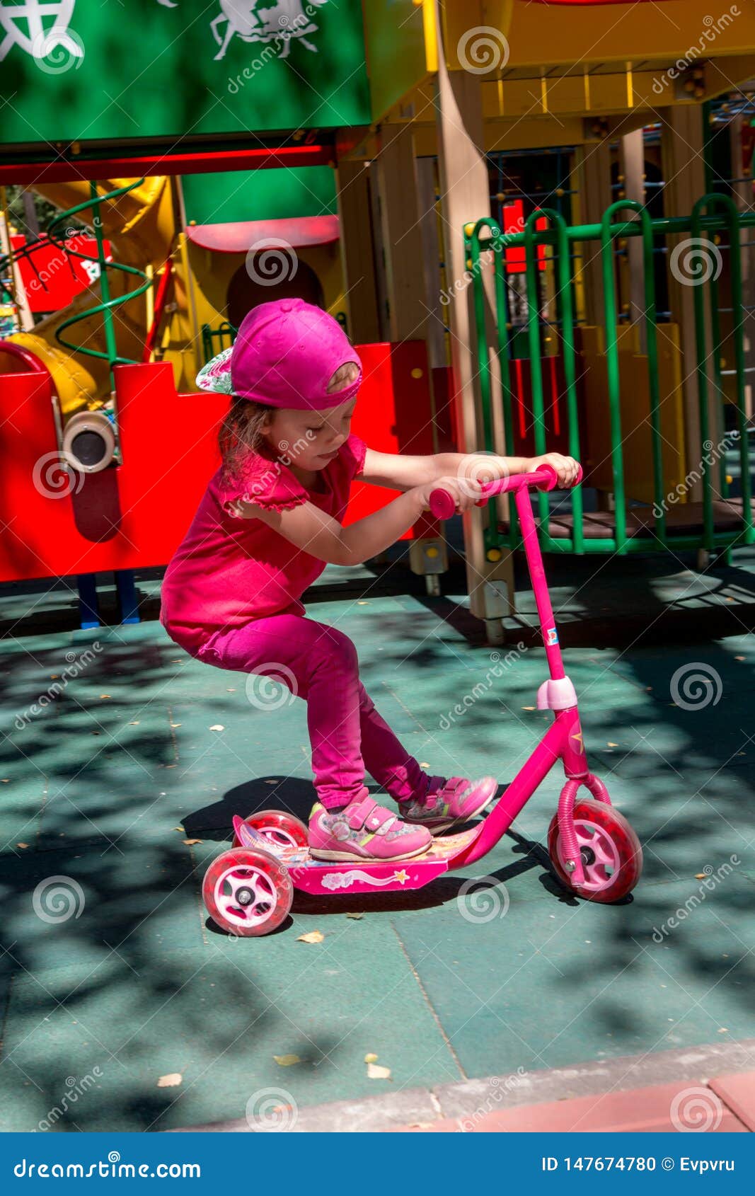 Child riding a scooter stock photo. Image of game, person - 147674780