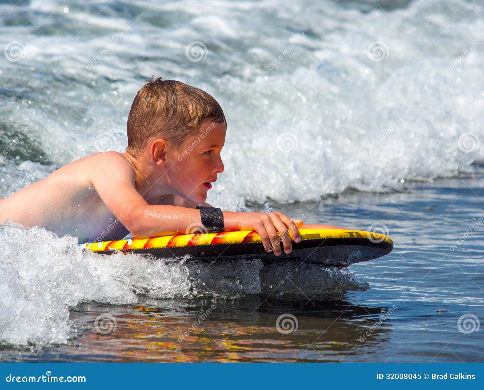 Child riding waves stock image. Image of summer, active - 32008045